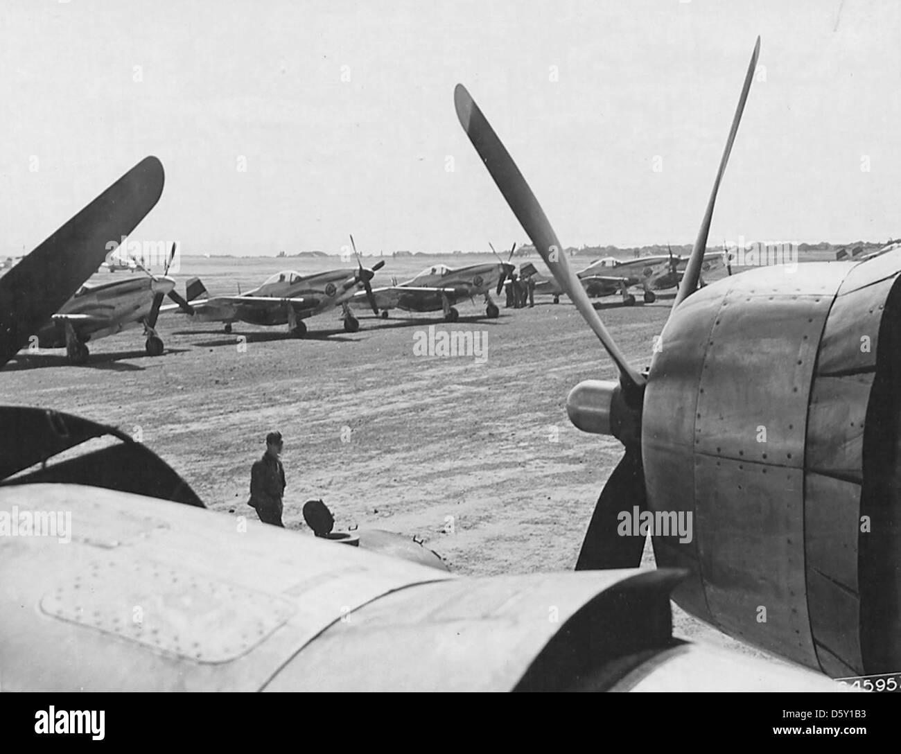 North American P-51 Mustangs are seen parked on an airstrip at Iwo Jima ...