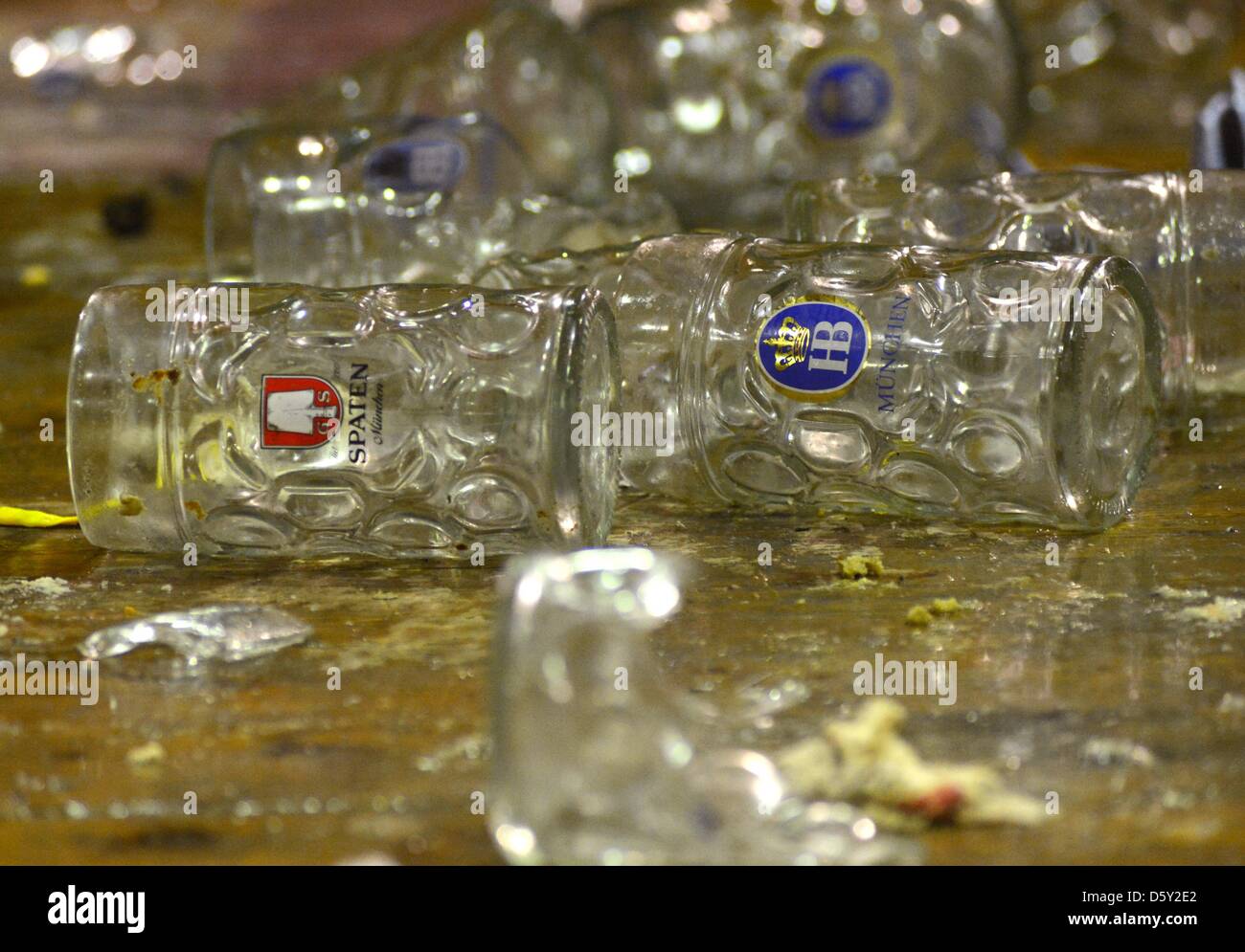 Broken beer mugs lie on the ground after the Oktoberfest's traditional ...