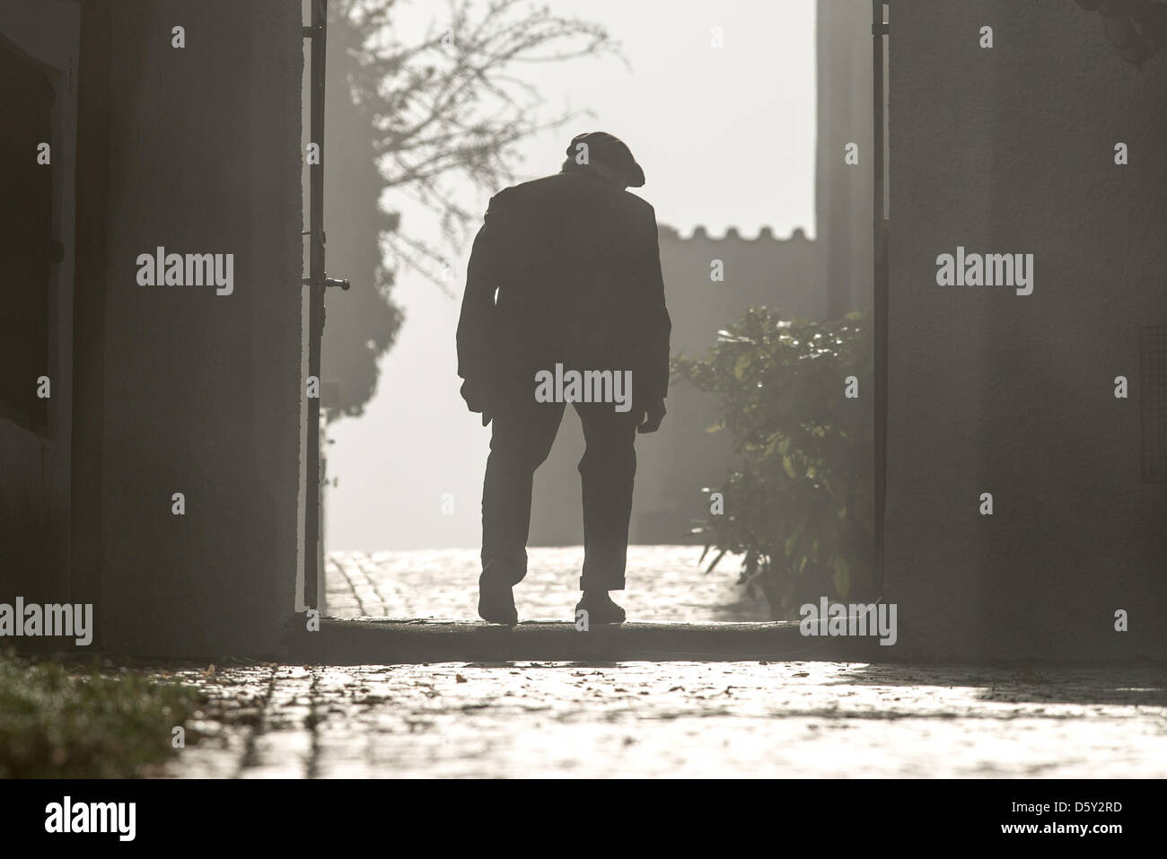 An old man walks through a gate in Bogen, Germany, 08 October 2012 ...