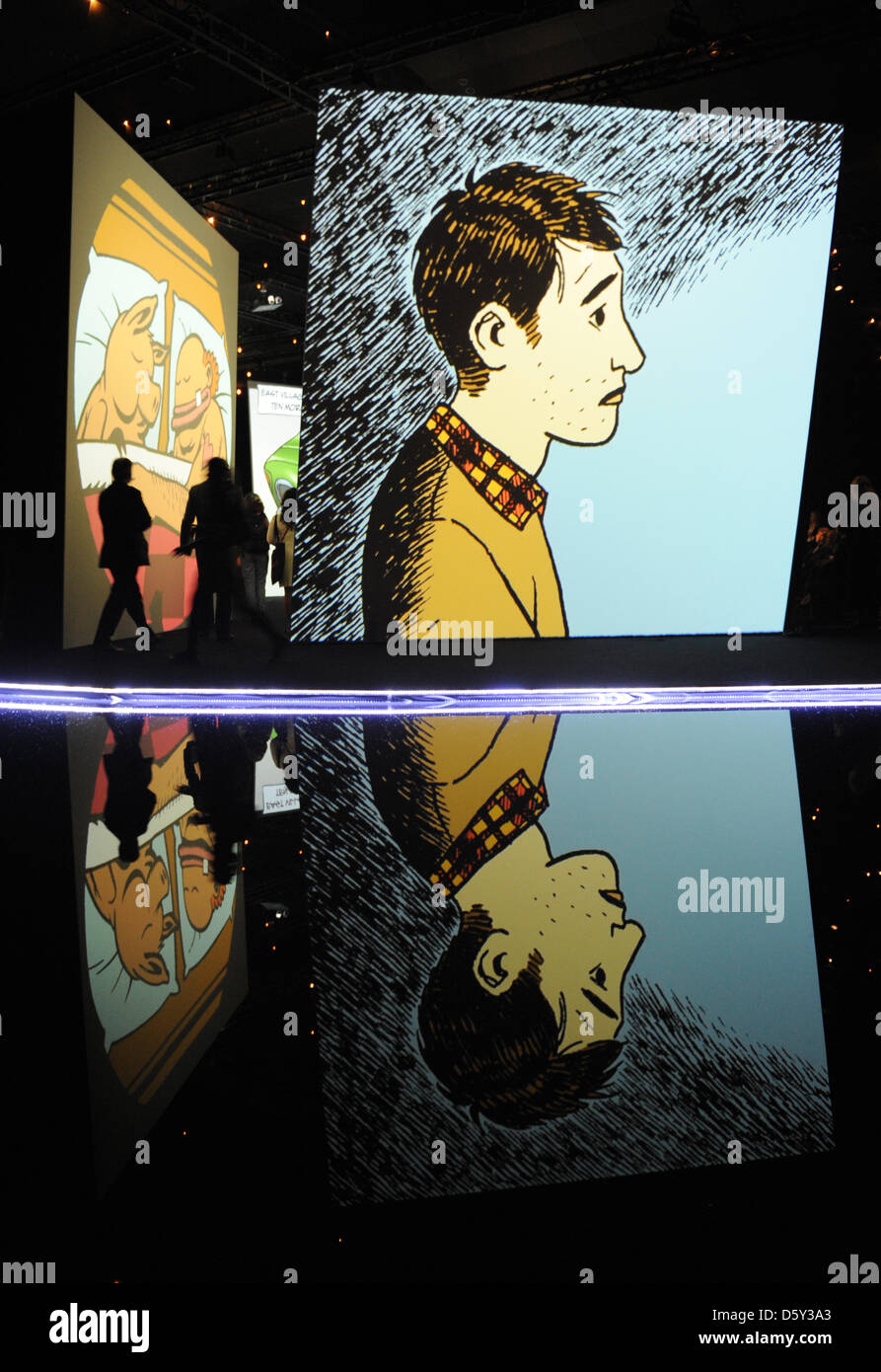 Images from comics are projected on a huge screen at the stand of New ...