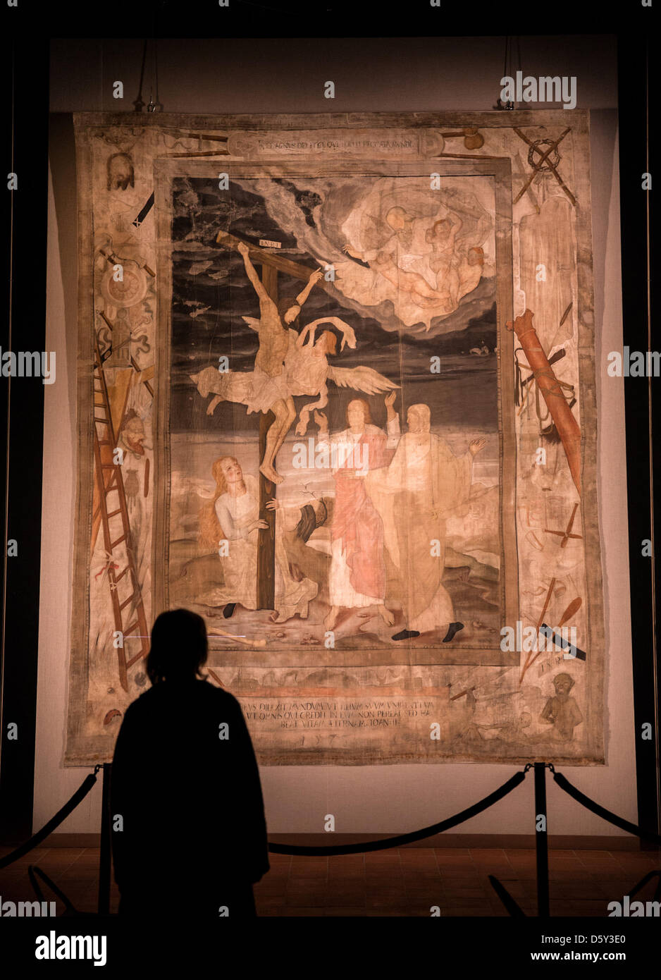 A woman stands in front of the "Kleine Zittauer Fastentuch" ("small ...