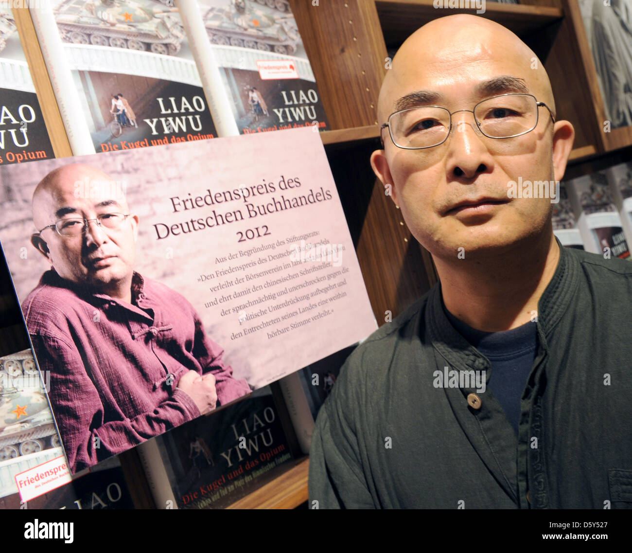 Writer Liao Yiwu Poses For The Camera At A Booth Of Publisher Sfischer At The Frankfurt Book