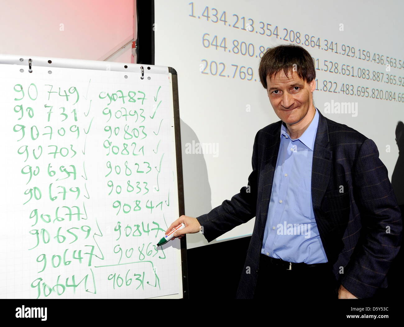 Mathematical genius Gert Mittring stands in front of a board with ...