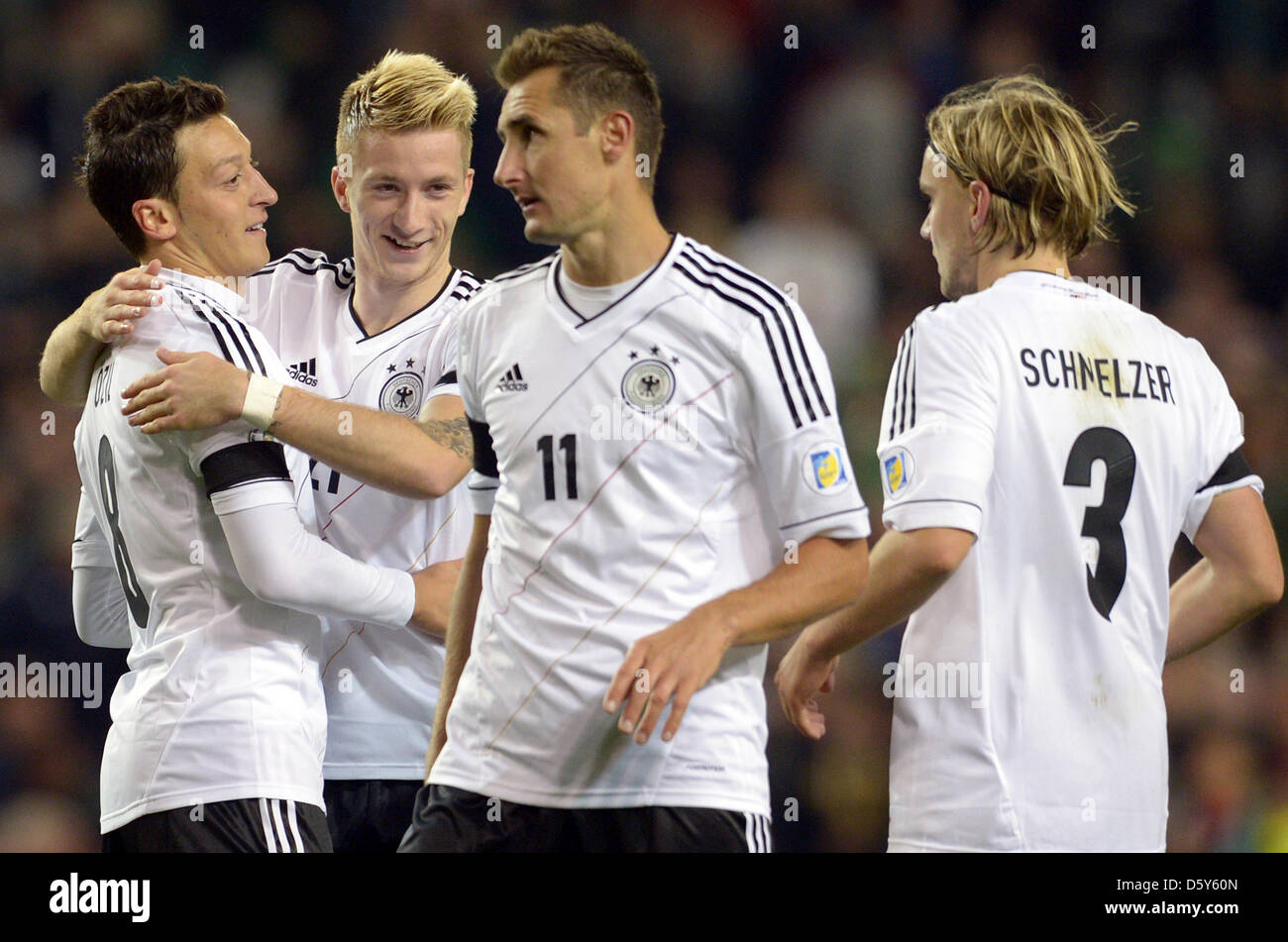 Germany's Mesut Oezil (L-r) celebrates with team mates Marco Reus ...