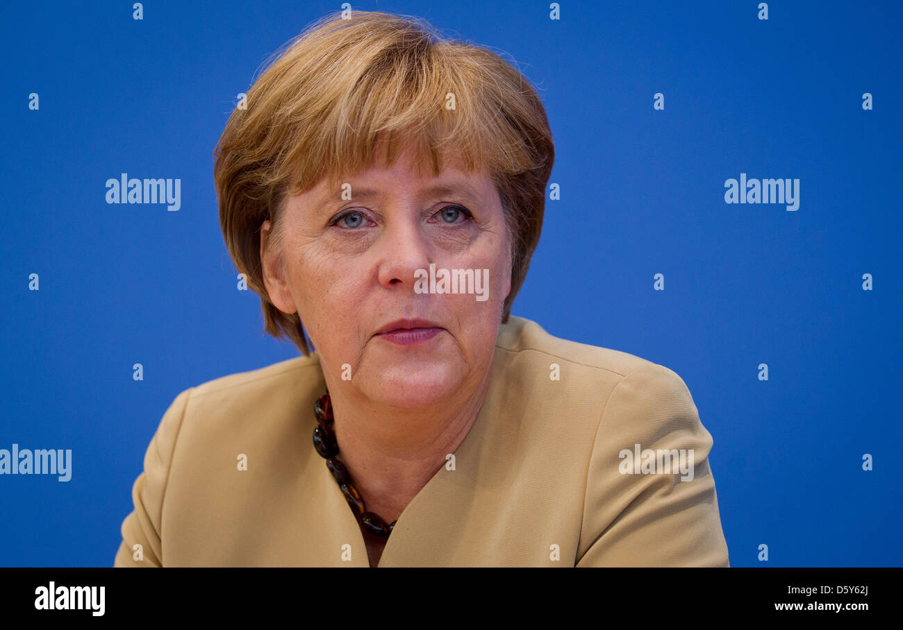 German Chancellor Angela Merkel speaks at a press conference in Berlin ...