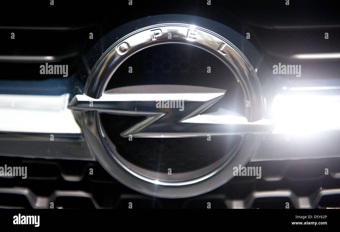 The company's logo is set up on the front of an Opel car in Berlin ...