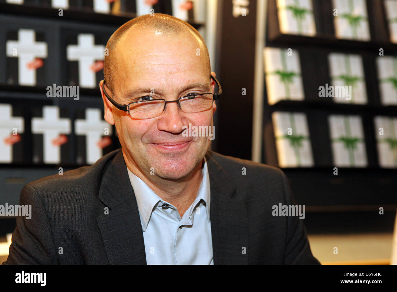 British writer Simon Beckett signs autographs during the presentation ...