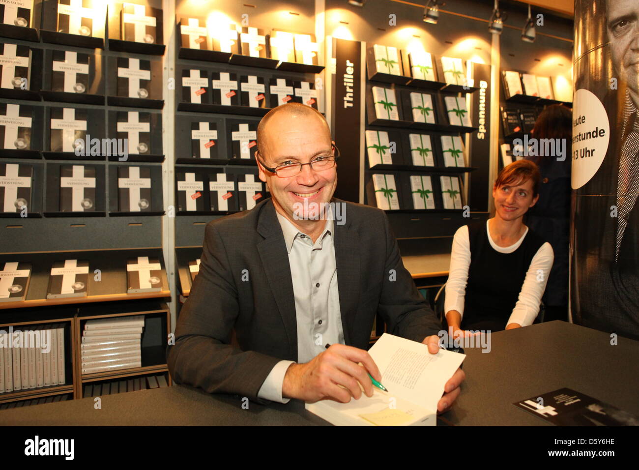British writer Simon Beckett signs autographs during the presentation ...