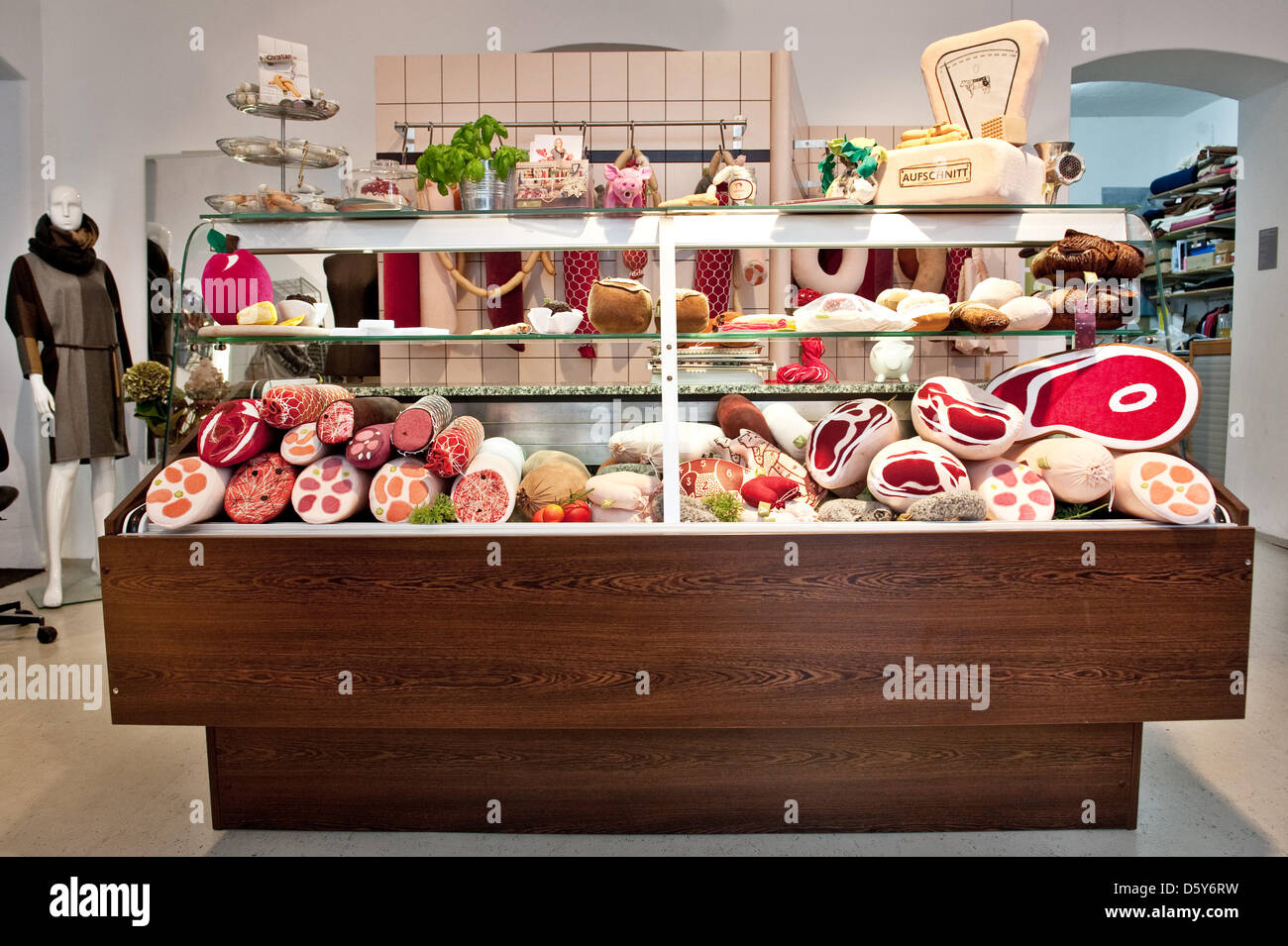 Meat and saussages made of cloth are visible at the mock butchery and ...