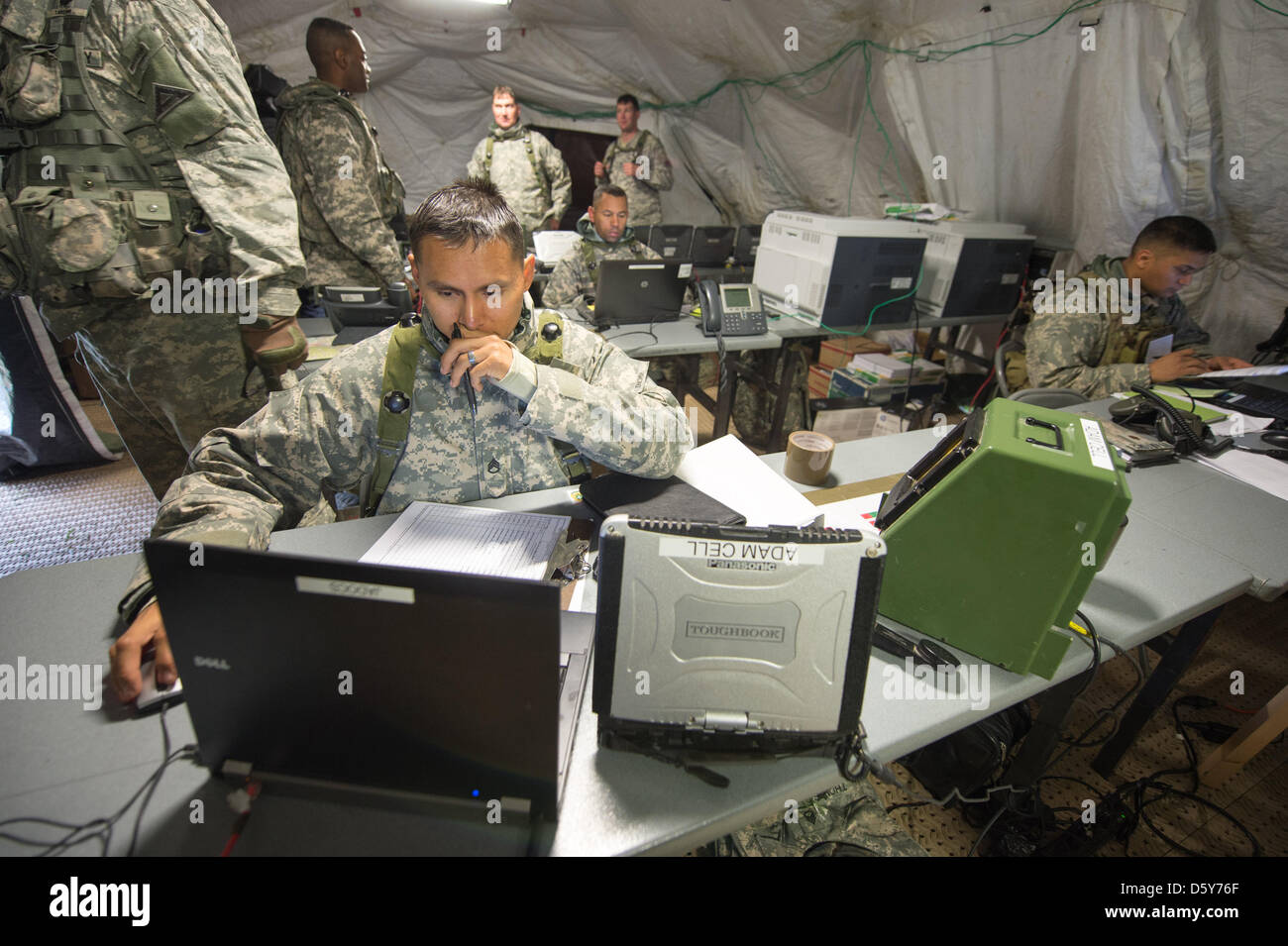 US soldiers work at a mobile tactical communication center on the ...