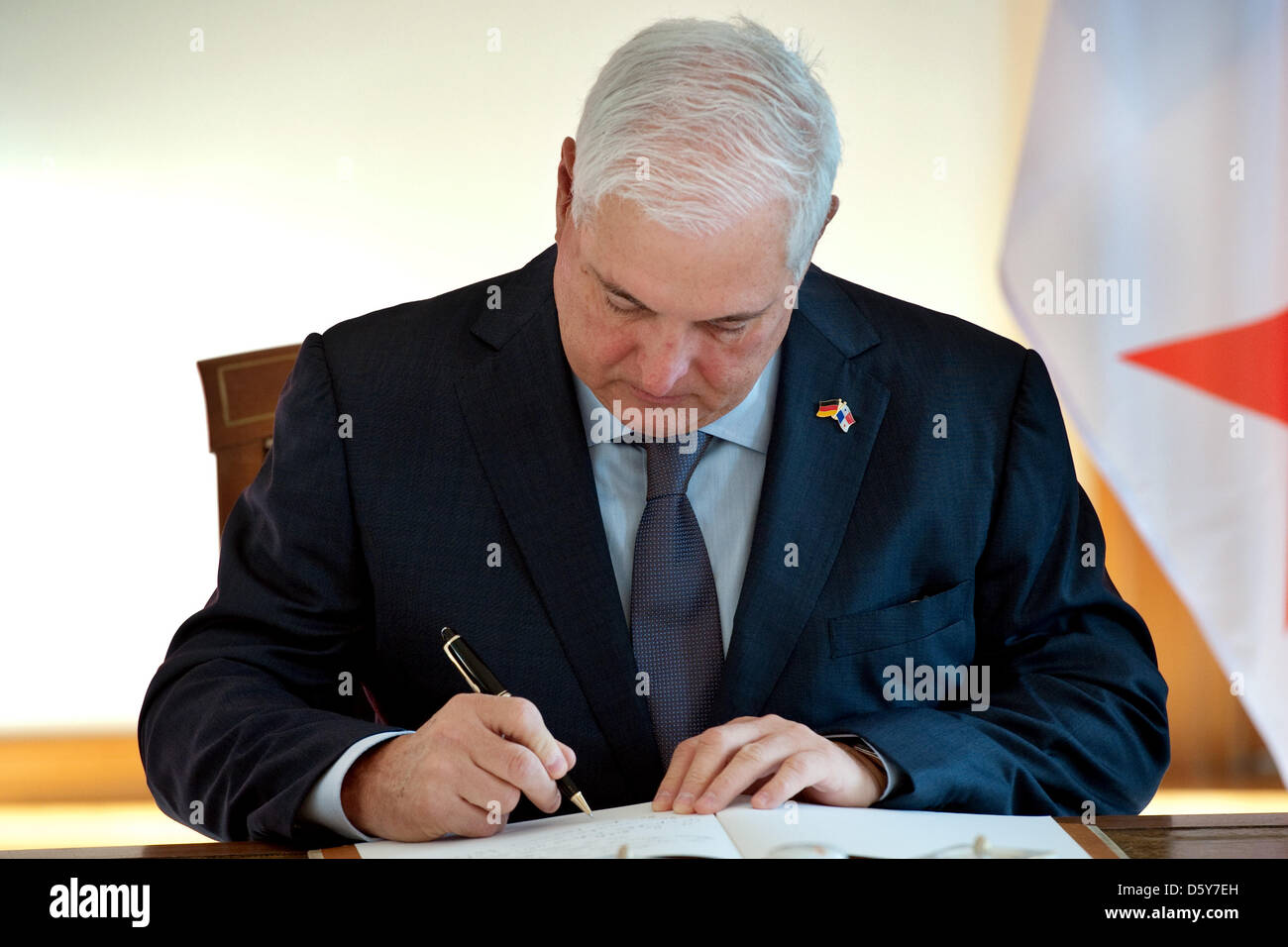 President of Panama, Ricardo Martinelli, signs the visitors book at ...