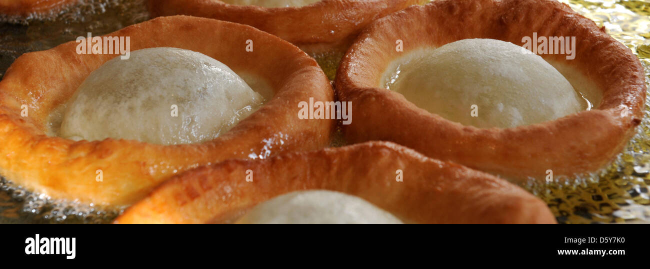 Pastries, Schmalzgebaeck, from leavened dough swim in hot oil at Cafe ...