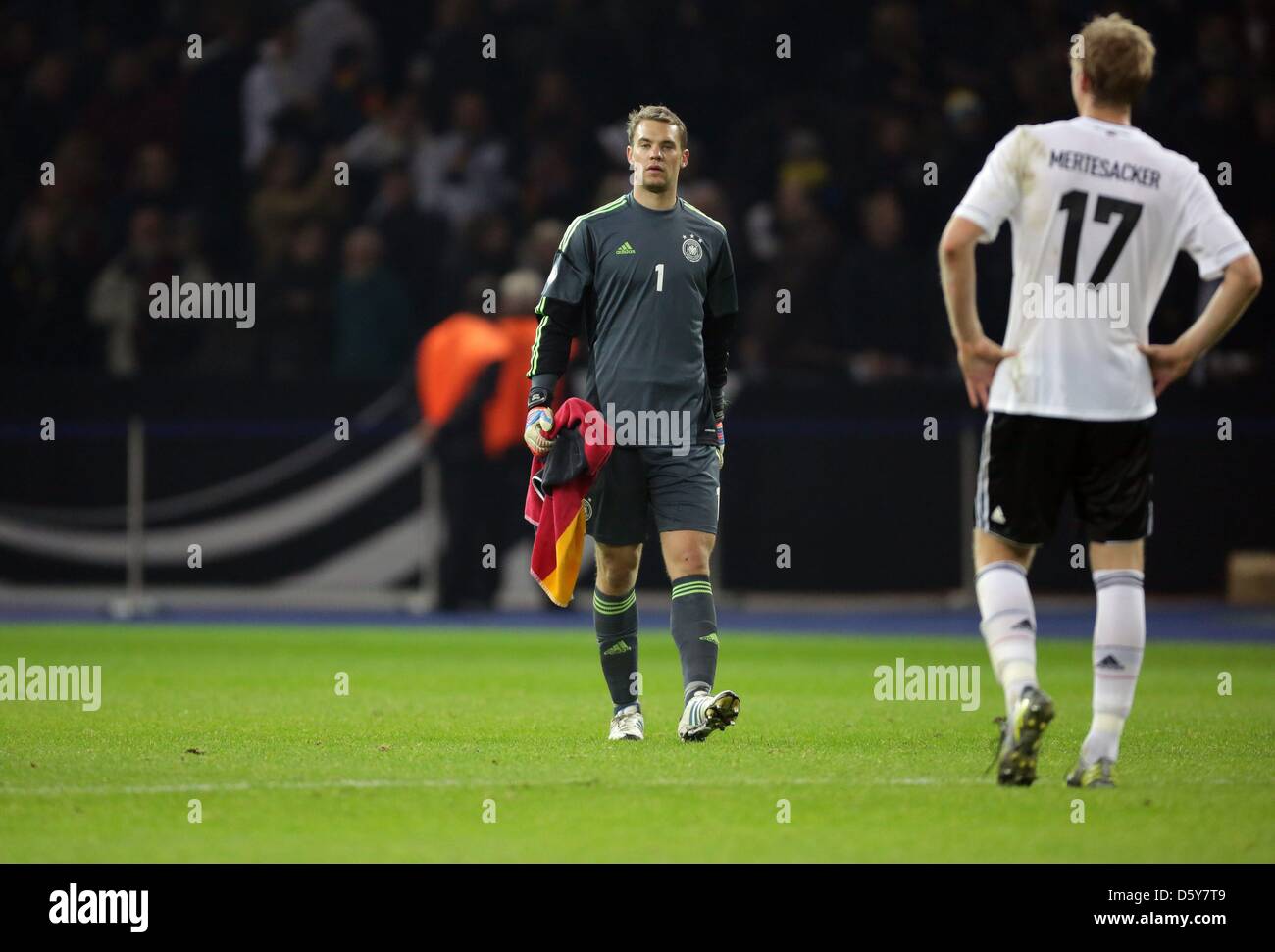 Germany's goal keeper Manuel Neuer (L) leaves the ground after the FIFA ...