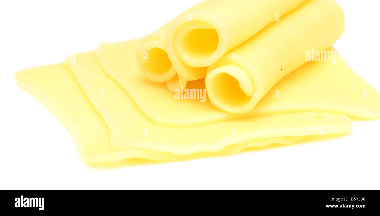 rolled and sliced cheese isolated on white Stock Photo - Alamy