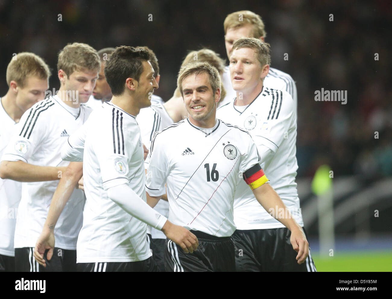 Germany's Philipp Lahm (C) and Mesut Oezil (C-L)celebrates during the ...