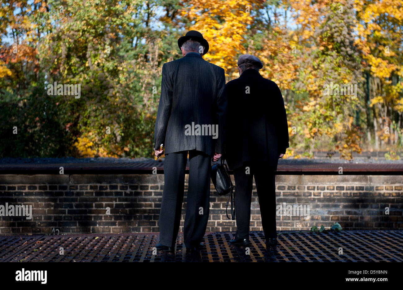 Two visitors attend a commemorative event at Memorial Gleis 17 (track ...