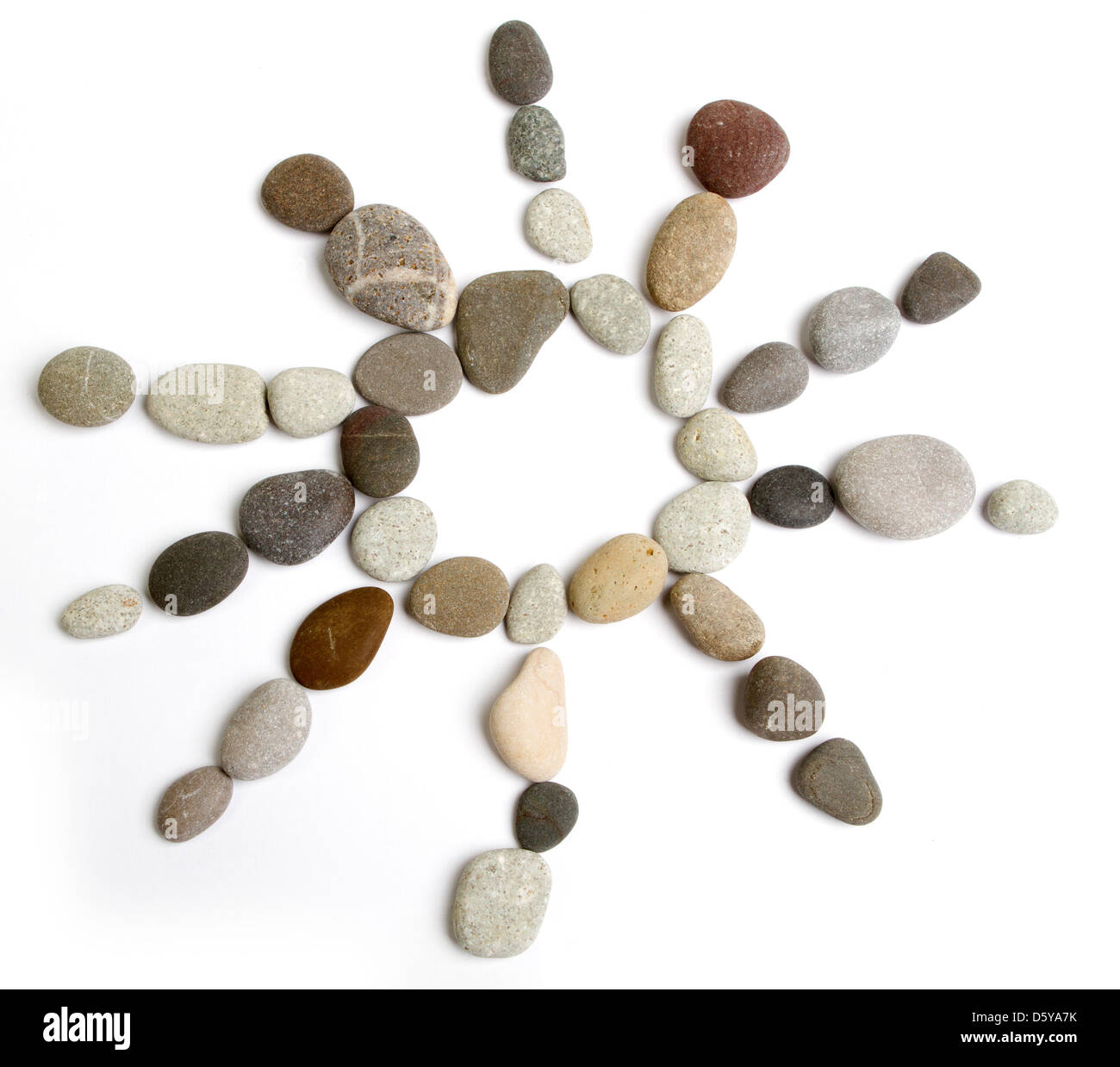 Pebble sun isolated on white background Stock Photo - Alamy
