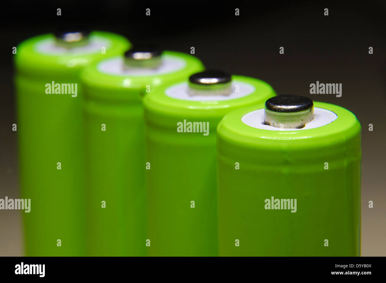 row of green rechargeable batteries with focus on front one Stock Photo ...