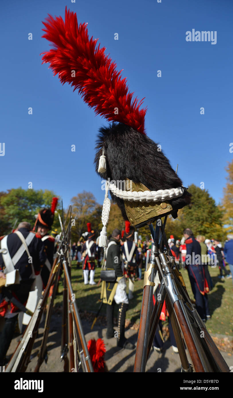 A uniform hat of a French hisotric uniform has been places on top of ...
