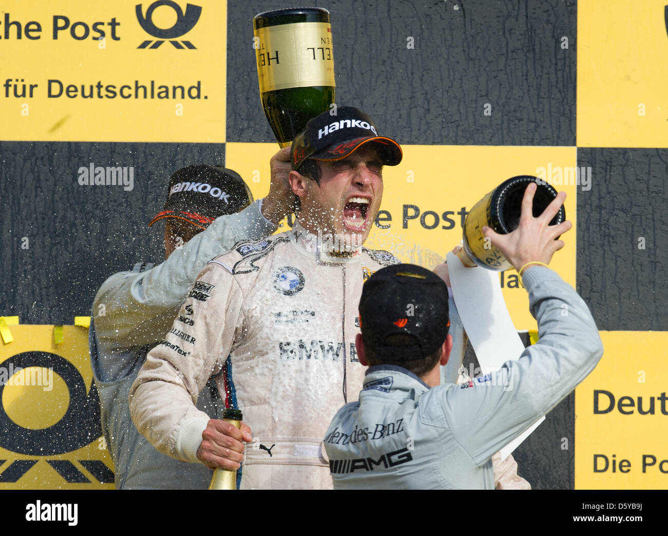 Canadian racing driver Bruno Spengler (C) of team BMW Schnitzer ...