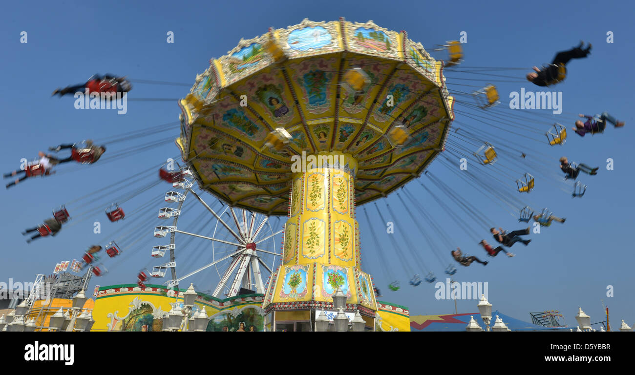 Visitors drive a carousel at Freimarkt funfair in Bremen, Germany, 21 ...