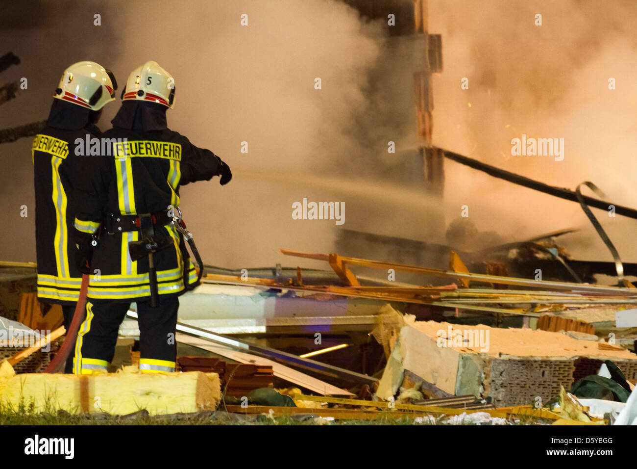 Firemen put out a fire at an exploded house in Ehrenfriedersdorf ...