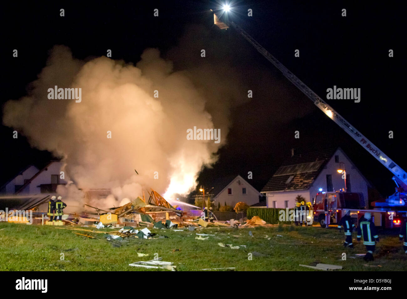 Firemen put out a fire at an exploded house in Ehrenfriedersdorf ...