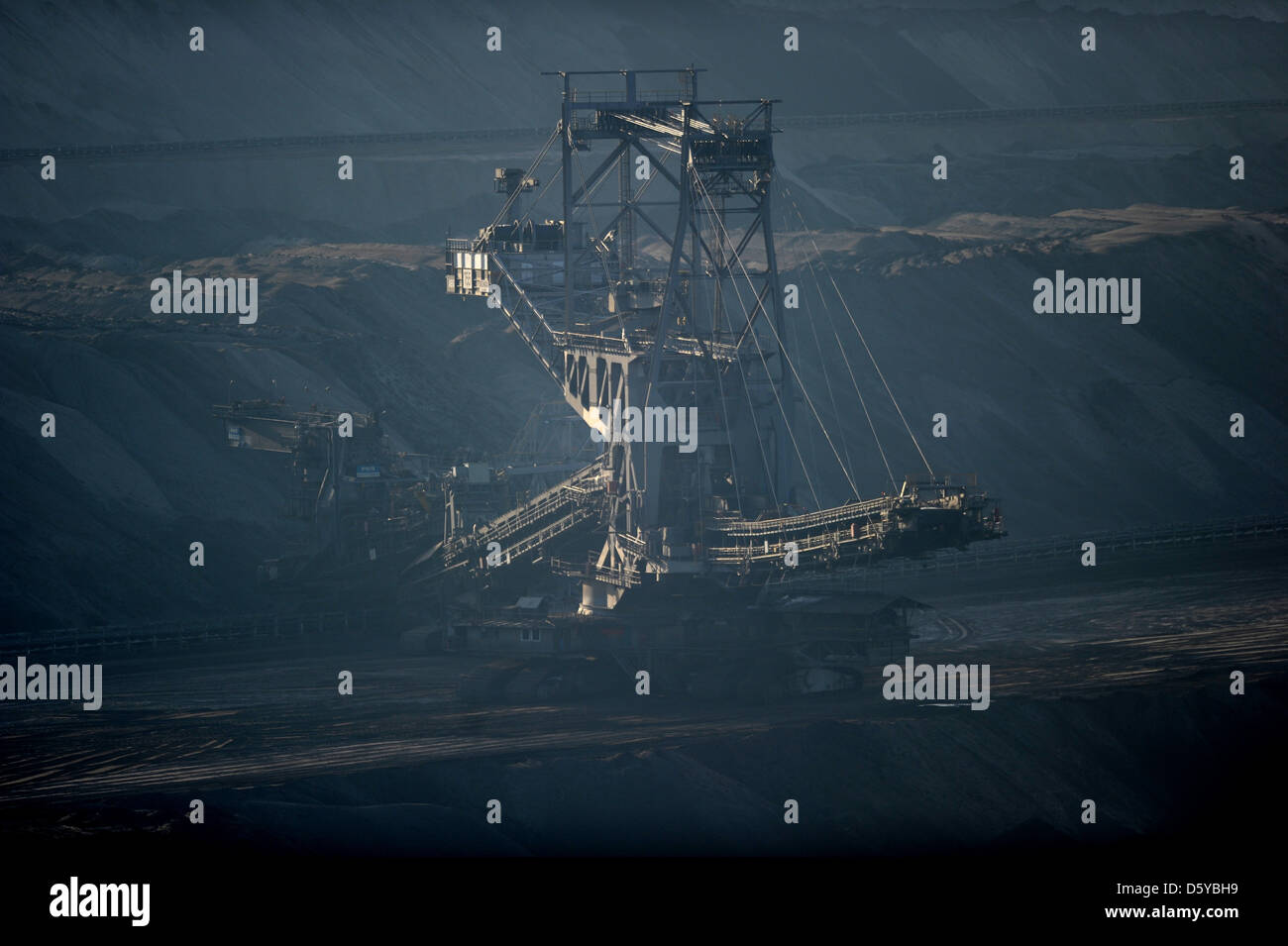 An excavator mines brown coal at the brown coal mine Garzweiler near ...