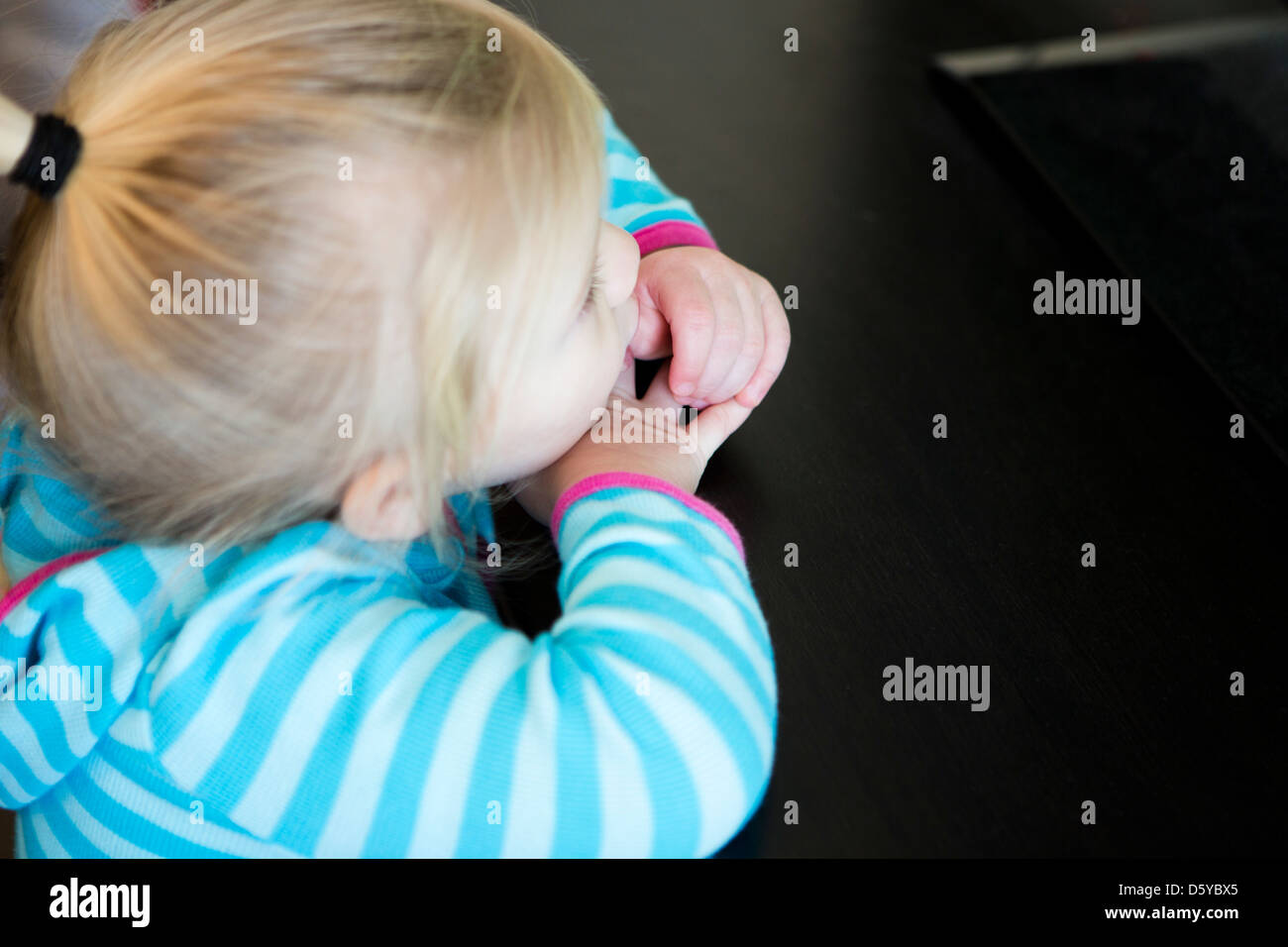 Baby girl resting head on hi-res stock photography and images - Alamy