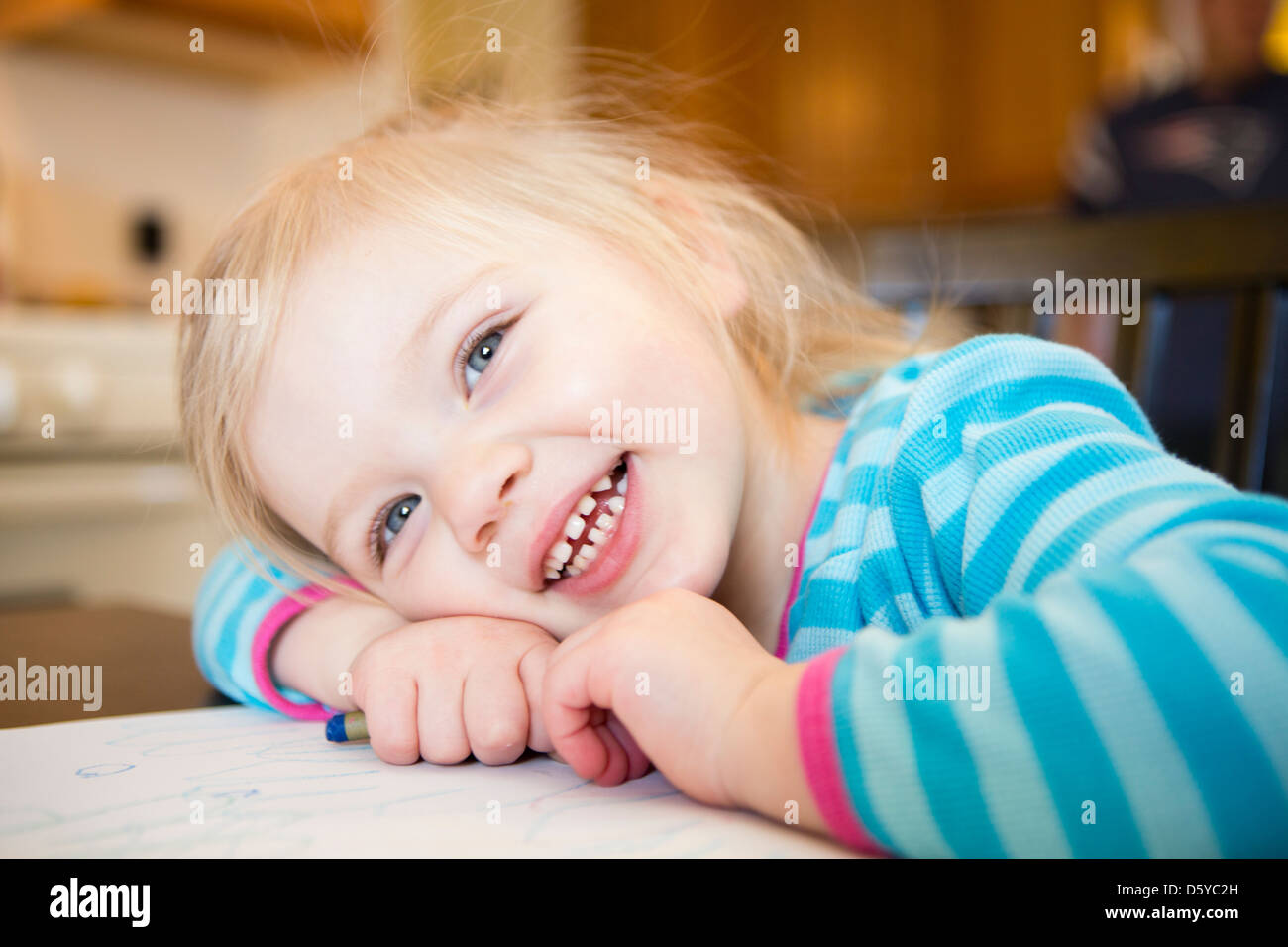 Girl resting head on table hi-res stock photography and images - Alamy