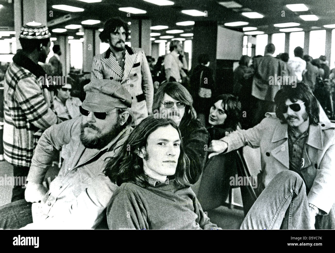TRAFFIC Promotional photo of UK rock group at an airport about 1968 ...
