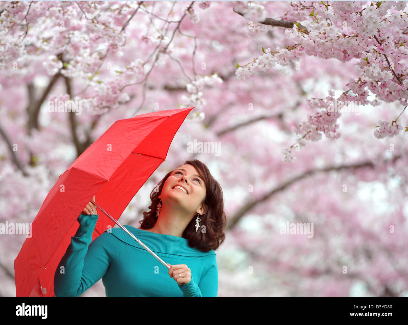 ILLUSTRATION - Regina holds a red umbrella in front of a Japanese ...