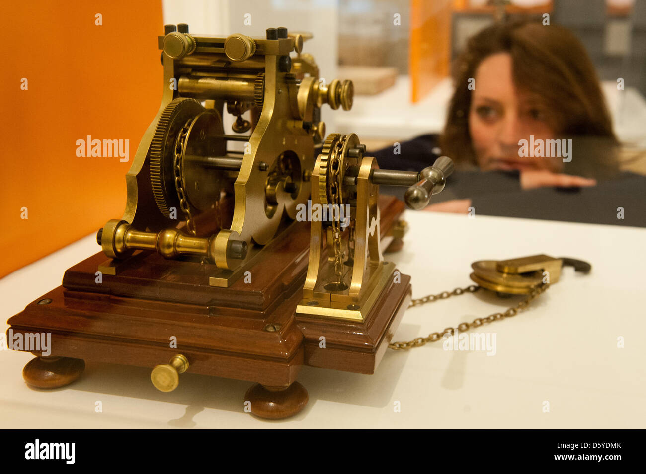A visitor watches a telegraph apparatus from 1853 during the exhibition ...