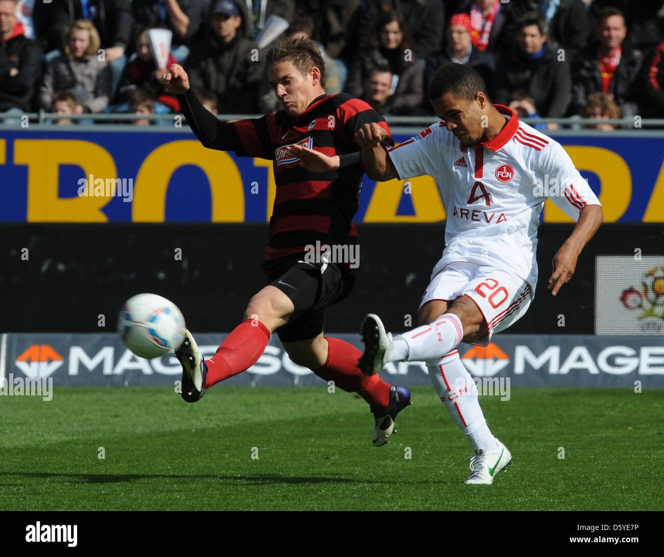 Freiburg's Oliver Sorg (L) vies for the ball with Nuremberg's Daniel ...