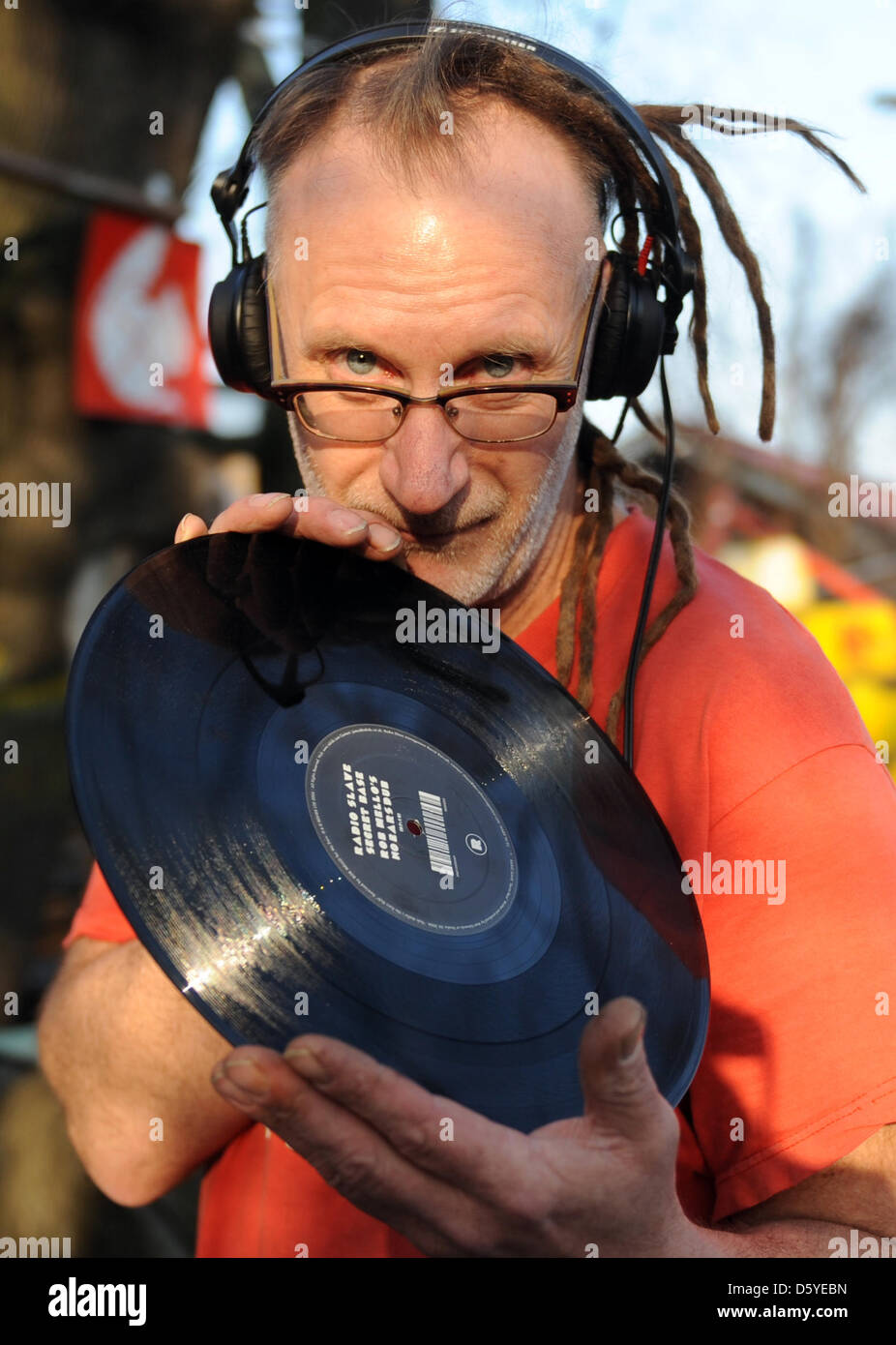 DJ Por No holds a record in his hands in Berlin, Germany, 16 March 2012 ...
