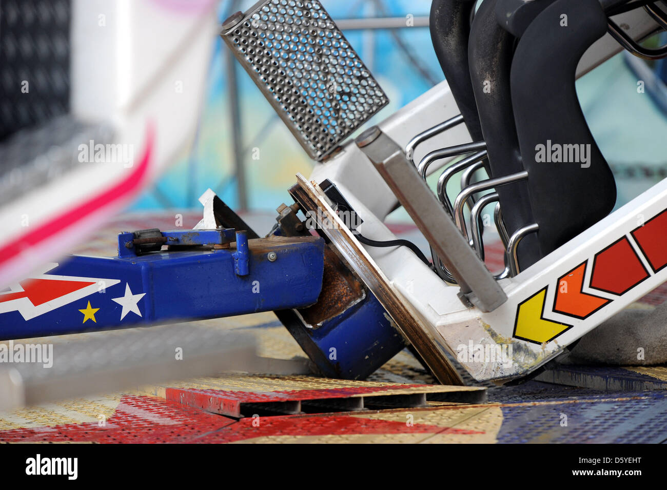 Police officers investigate at a detached car of amusement ride ...