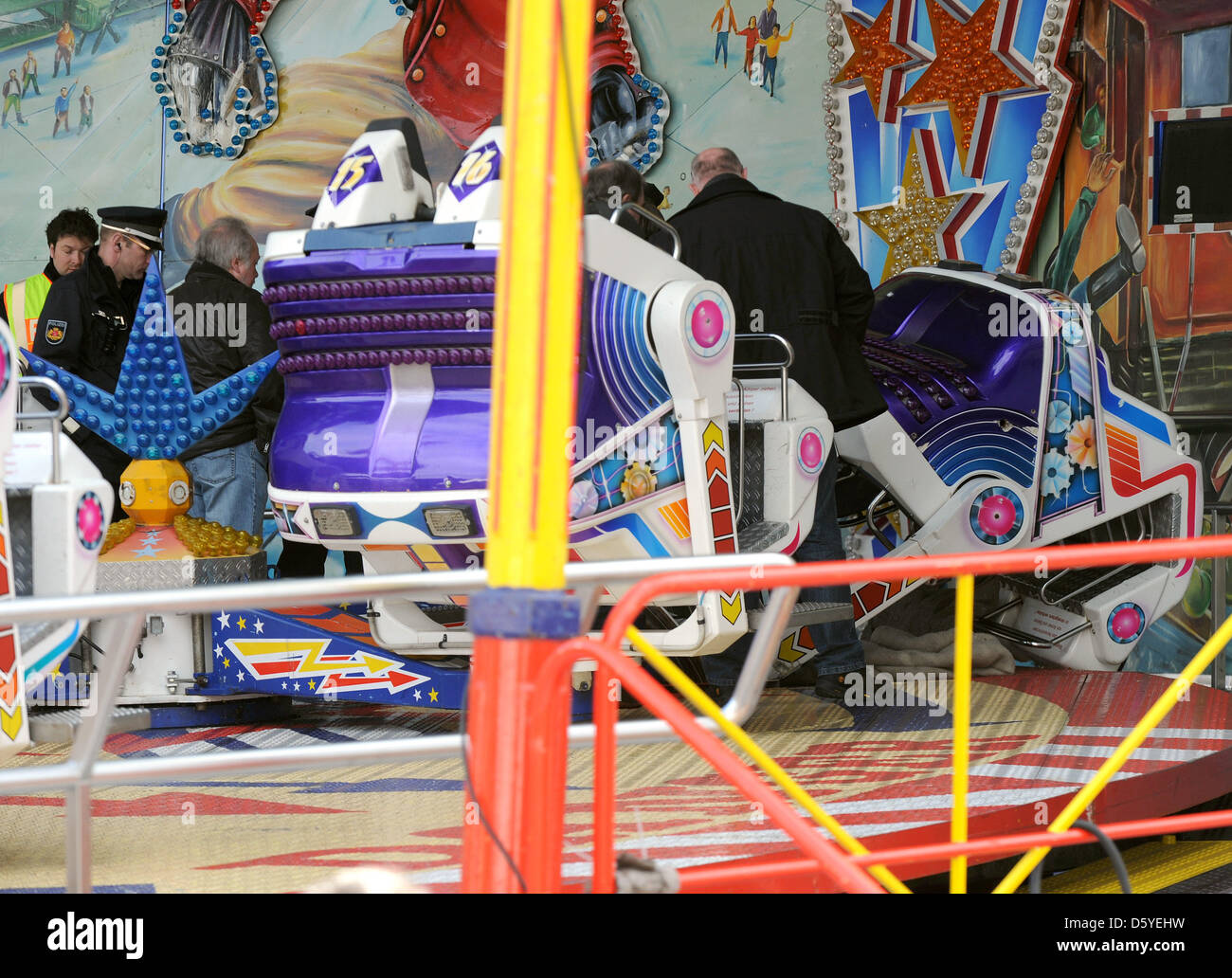 Police officers investigate at a detached car of amusement ride ...