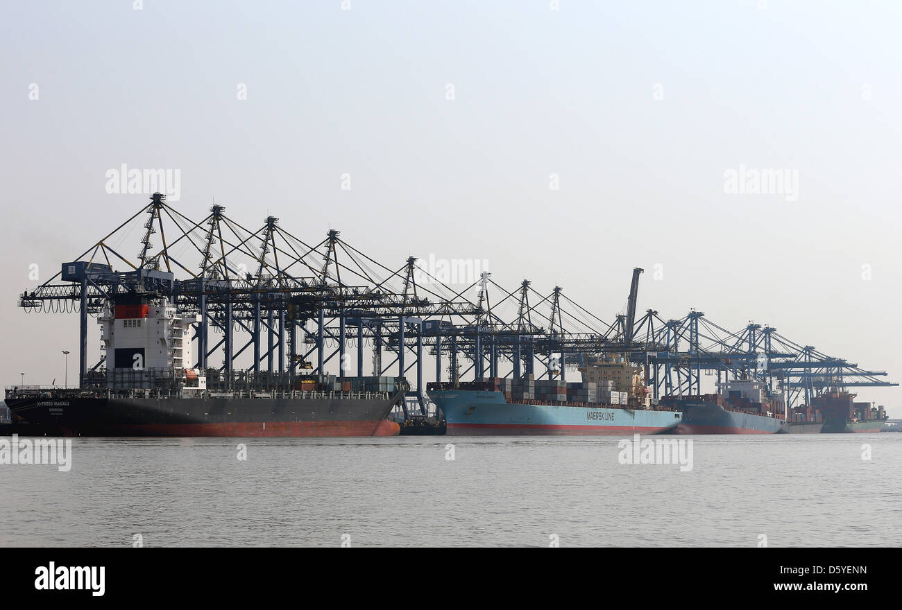 Container ships are moored at the Nhava Sheva International Container ...
