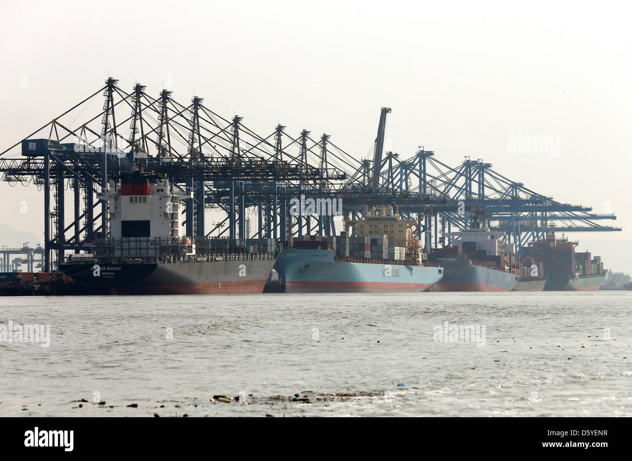 Container ships are moored at the Nhava Sheva International Container ...