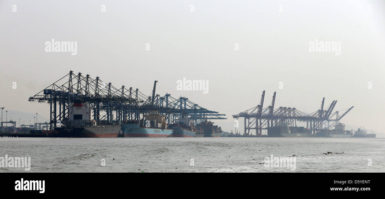Container ships are moored at the Nhava Sheva International Container ...