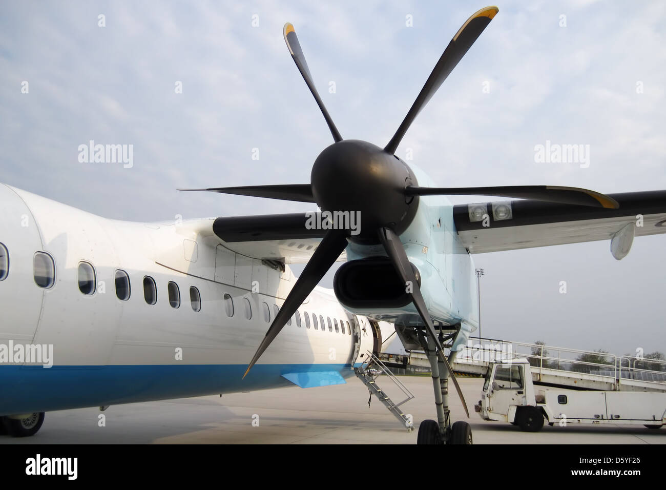 Side propeller of the plane with airplane at the airport Stock Photo ...