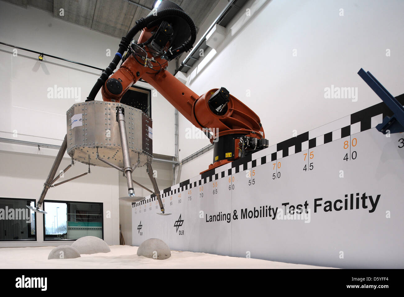 The action of a lunar lander (a small lunar module model) is ...