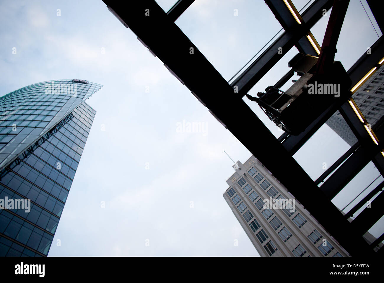 The roof windows are cleaned during dull weather at Potsdamer Platz ...