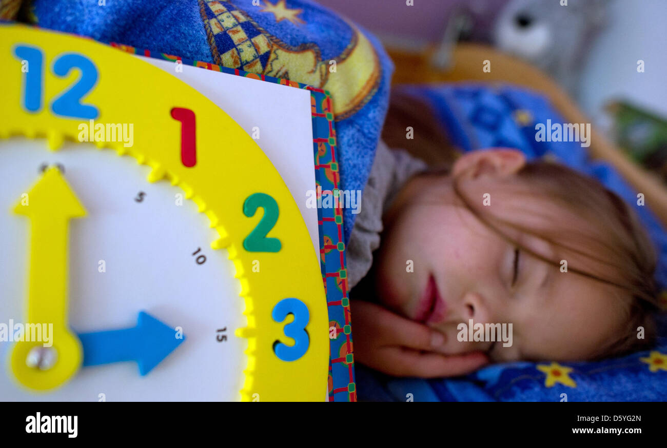 The illustration shows little girl Amy sleeping in her bed in ...
