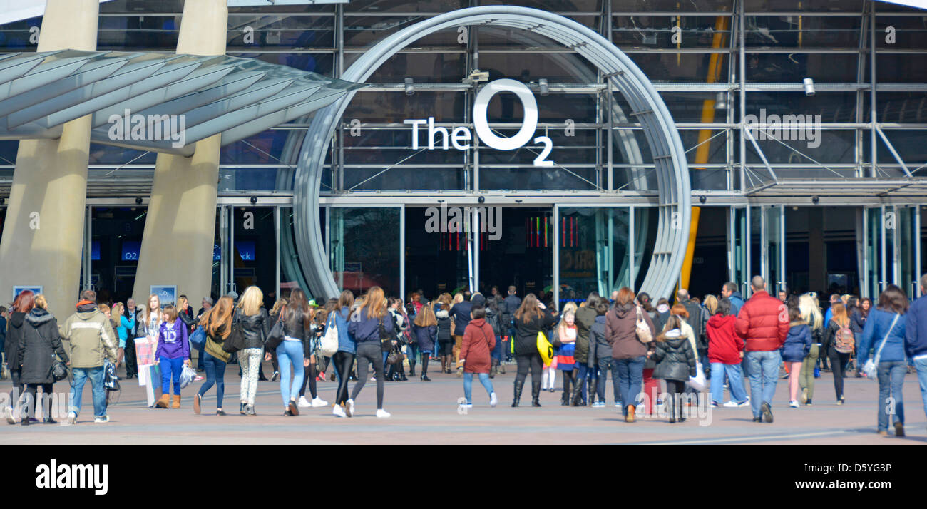 Group of teenagers fans some with adults & or parents at entrance to ...