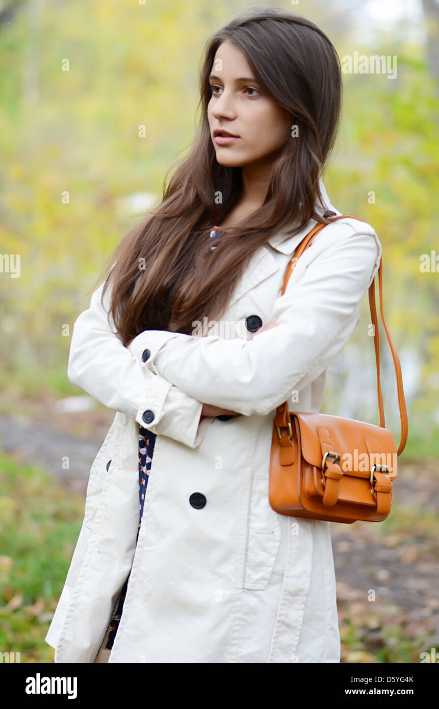 Beautiful young girl in autumn park Stock Photo - Alamy