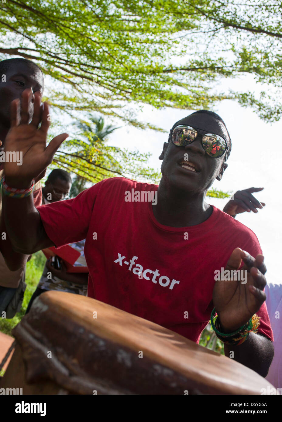 African man drumming with singers and dancers in Kribi Cameroon Africa ...