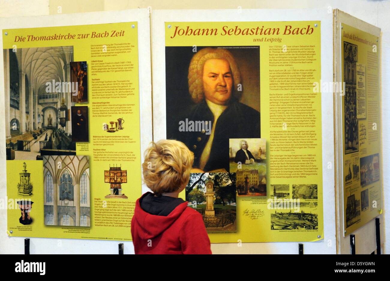 A young boy looks at an information board on composer Johann Sebastian ...
