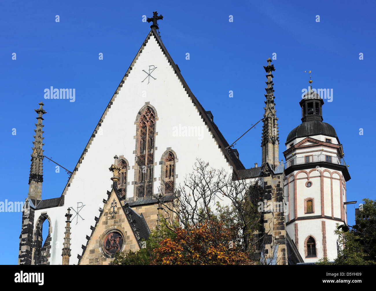 The St. Thomas Church of Leipzig is visible against the backdrop of a ...
