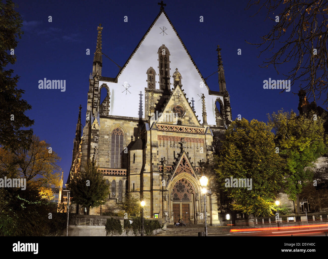 The St. Thomas Church of Leipzig is visible against the backdrop of a ...